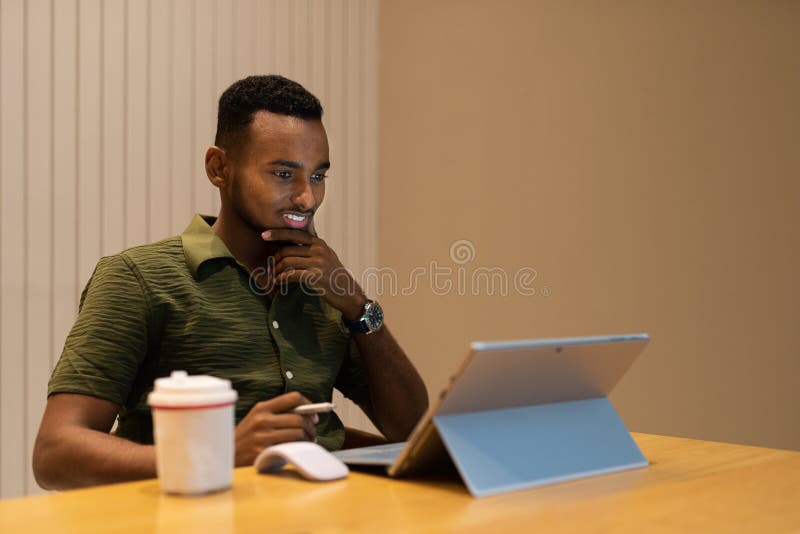 Portrait of Handsome Young Black Man Using Laptop Computer in Coffee ...