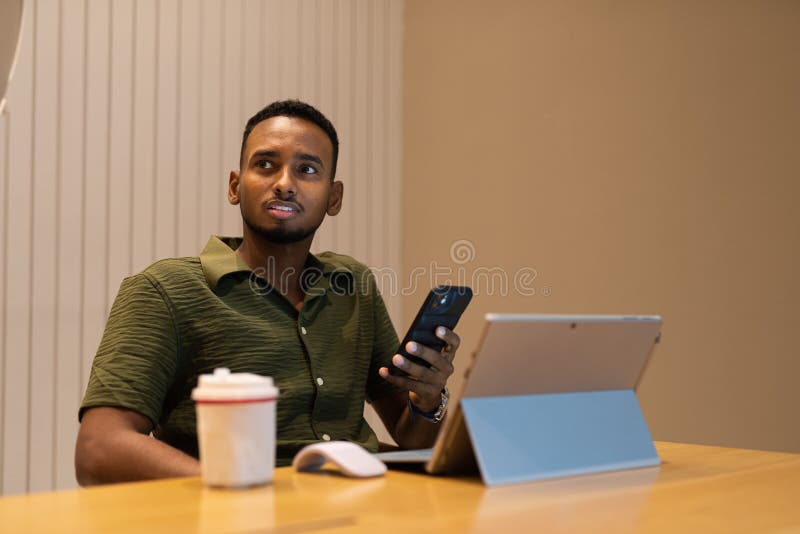Portrait of Handsome Young Black Man Using Laptop Computer in Coffee ...