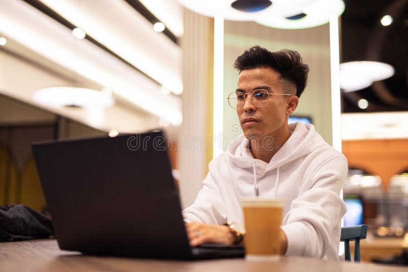 Portrait of Handsome Young Cool Man Using Laptop at Coffee Shop Stock ...
