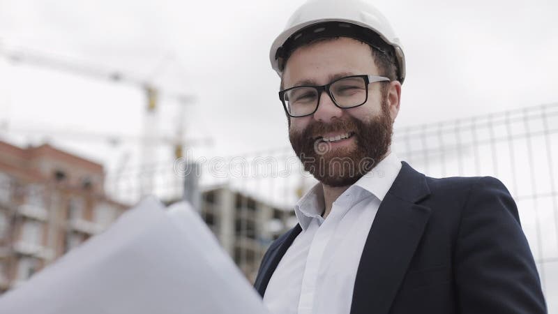 Portrait of Handsome Young Engineer on Building Site Looking at the ...