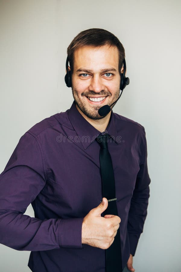 Portrait of Handsome Young Male Operator in Headset Looking at Camera ...