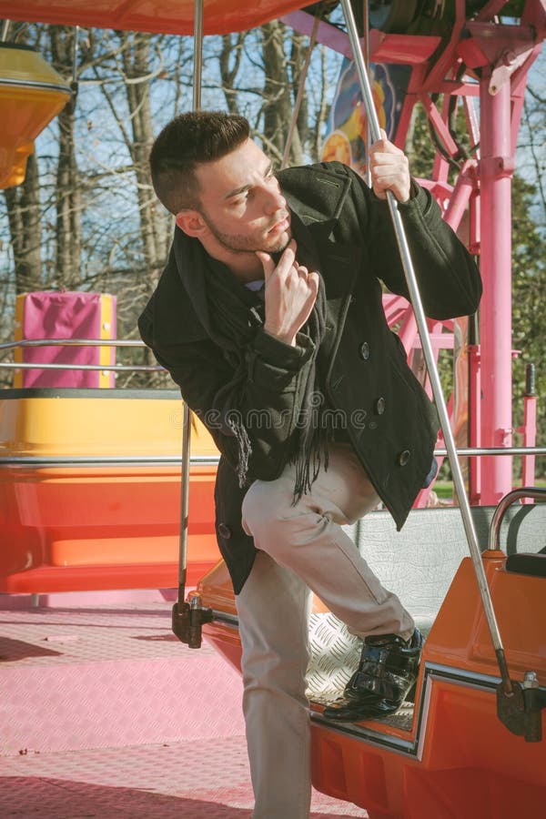 Portrait of a Handsome Young Man on Amusement Ride Stock Image - Image ...
