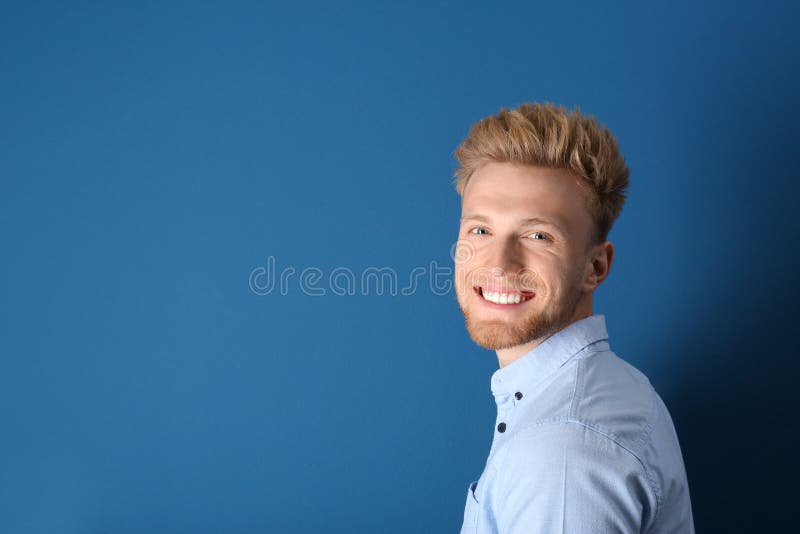 Portrait of Handsome Young Man on Blue Background Stock Image - Image ...