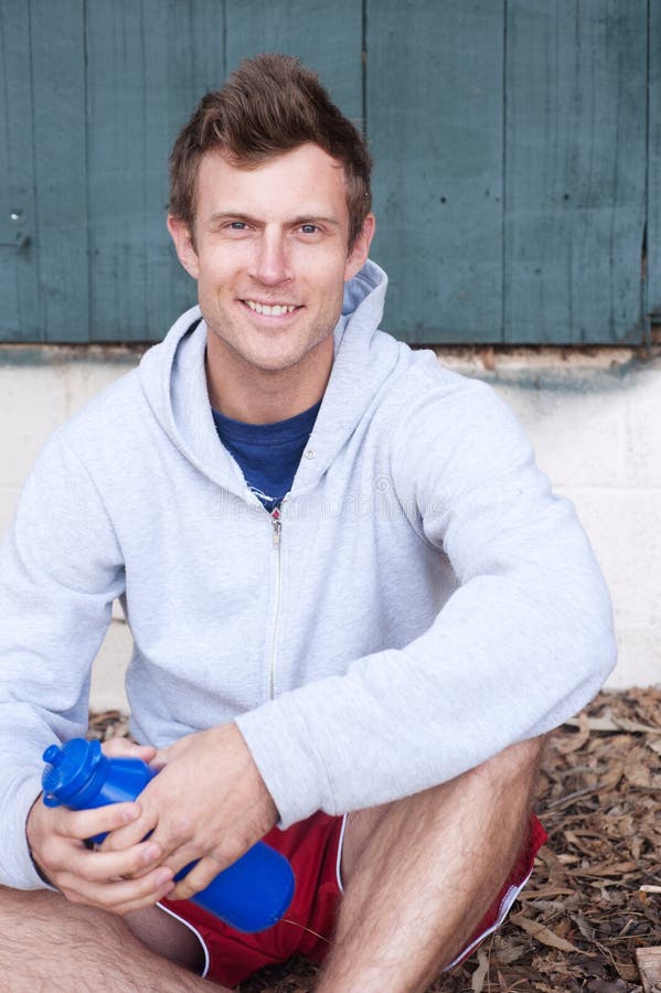 Portrait of a Handsome Young Man Holding Water Bot Stock Photo - Image ...