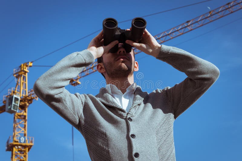 Portrait of a Handsome Young Man Looking through Binoculars Stock Image ...