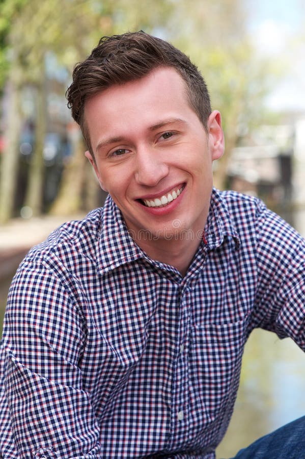 Portrait of a Handsome Young Man Relaxing Outdoors Stock Image - Image ...