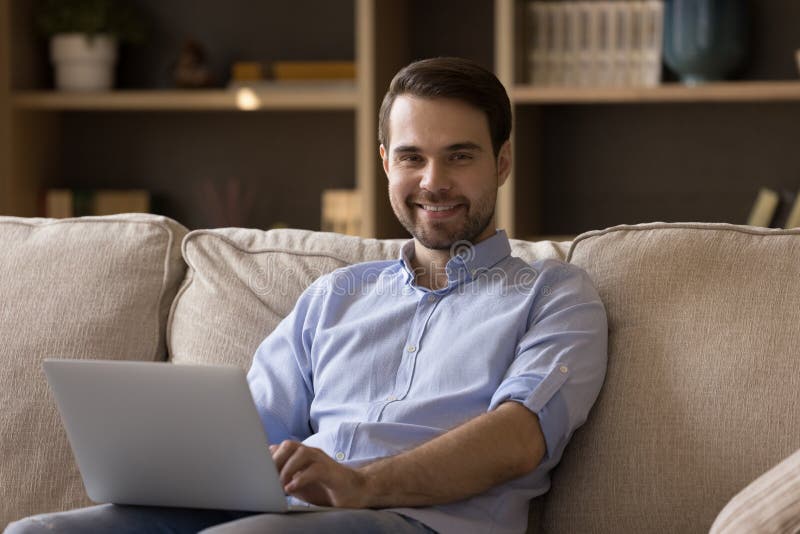 Portrait of Handsome Young Man Using Computer at Home. Stock Photo ...