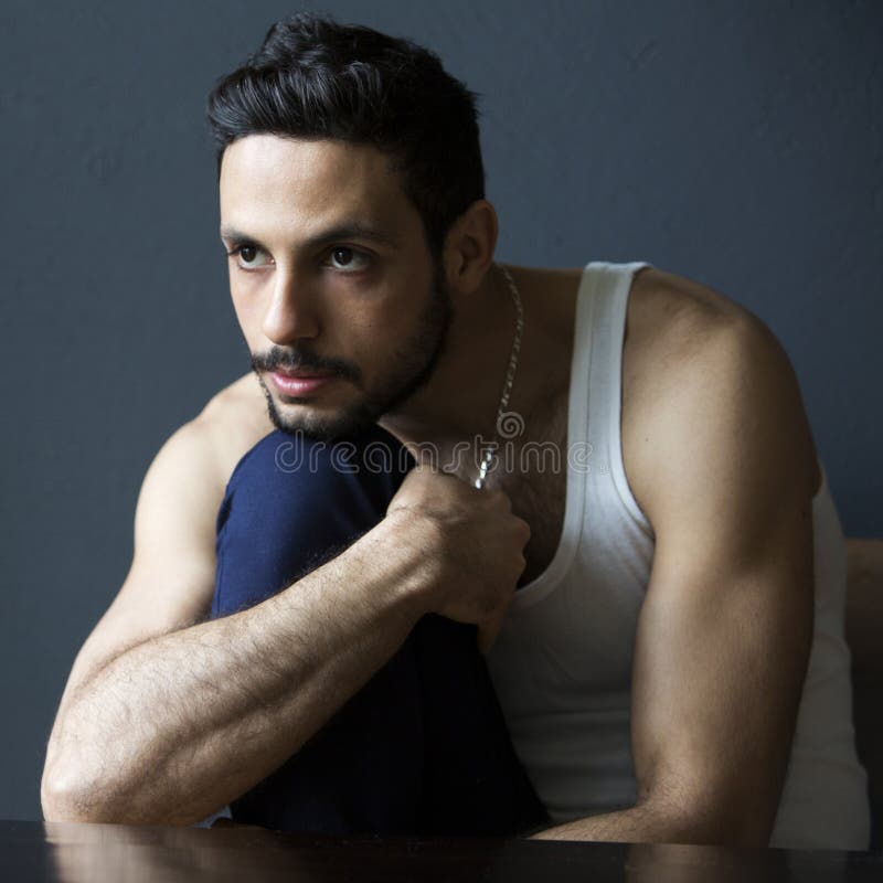 Portrait of Handsome Young Man Sitting at Table Stock Photo - Image of ...