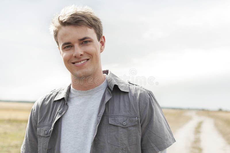 Portrait of Handsome Young Man Standing on Field Stock Photo - Image of ...