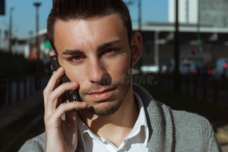 Portrait of a Handsome Young Man Talking on Phone Stock Photo - Image ...
