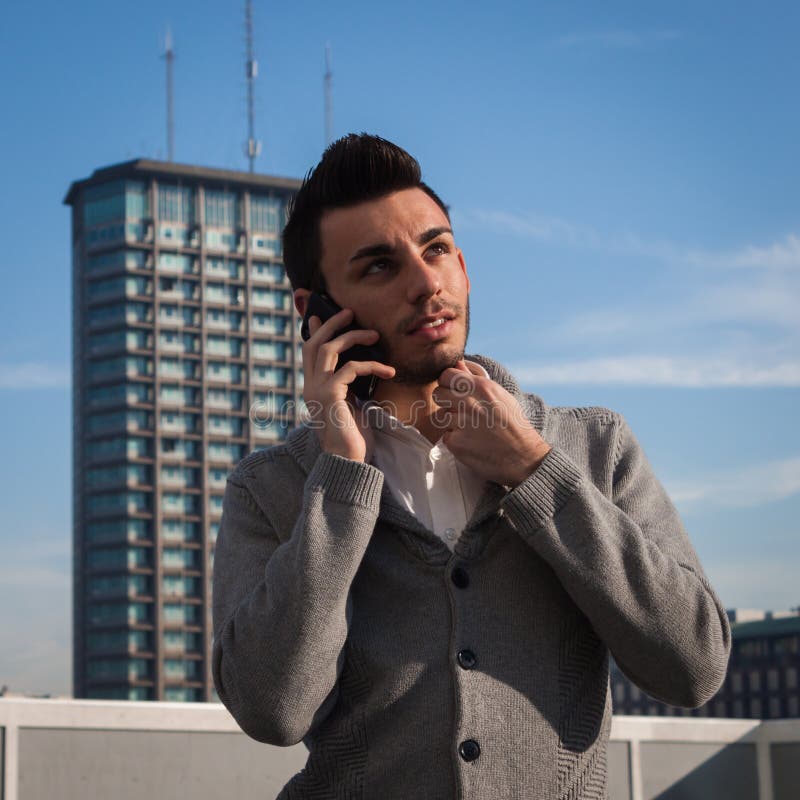 Portrait of a Handsome Young Man Talking on Phone Stock Image - Image ...
