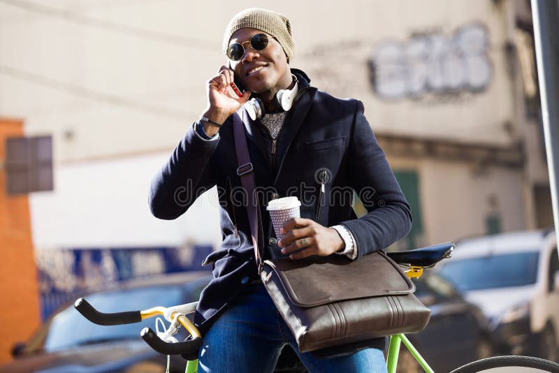 Handsome Young Man Using Mobile Phone and Fixed Gear Bicycle in the ...