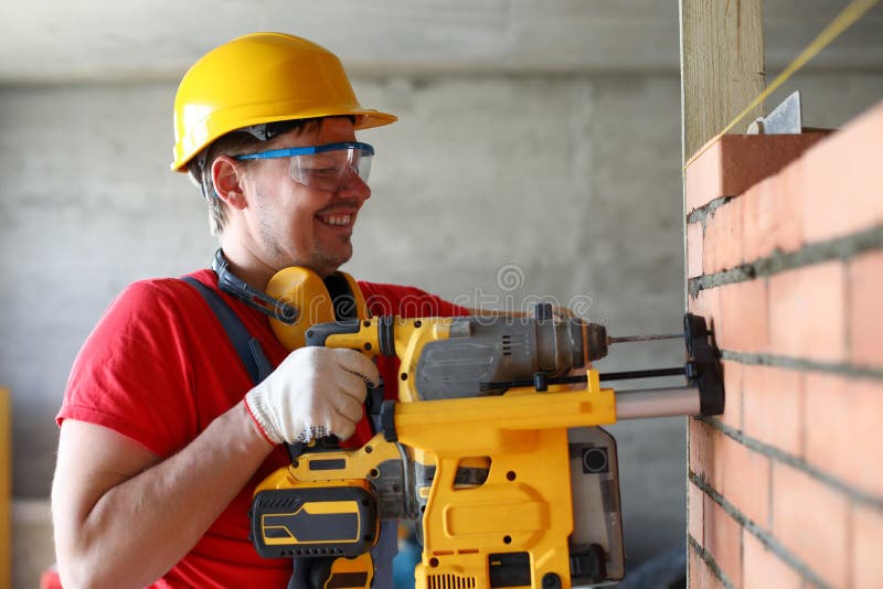 Builder Drilling Hole in Wall, Construction Site Stock Photo - Image of ...