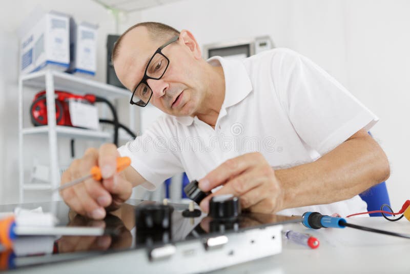 Portrait Handyman Repairing Appliances Stock Image - Image of fixing ...