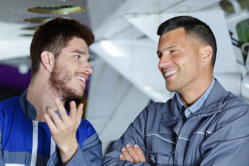 Portrait Hangar Workers Laughing Stock Photo - Image of work, social ...