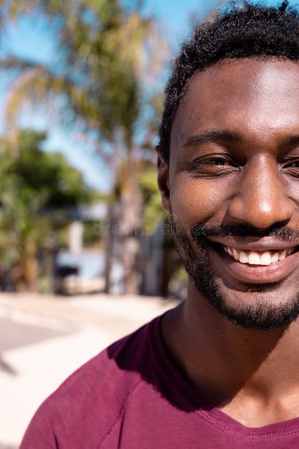 Portrait Of Happy African American Man Looking At Camera And Smiling At