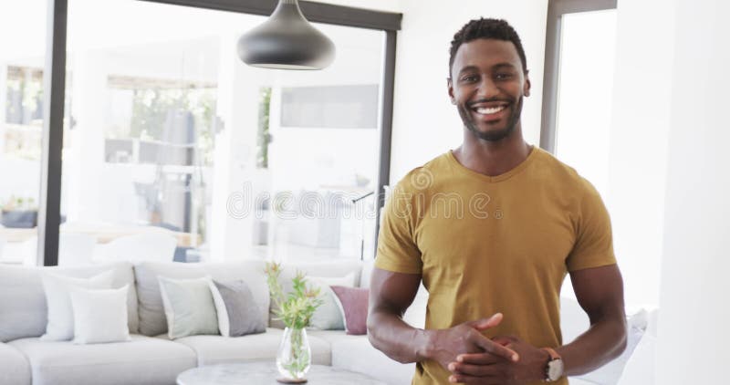 Portrait Of Happy African American Man Smiling In Living Room At Home