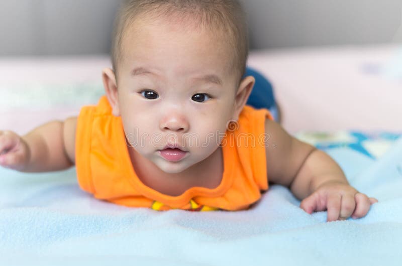 Portrait of Happy Asian Baby on the Bed Stock Image - Image of floor ...