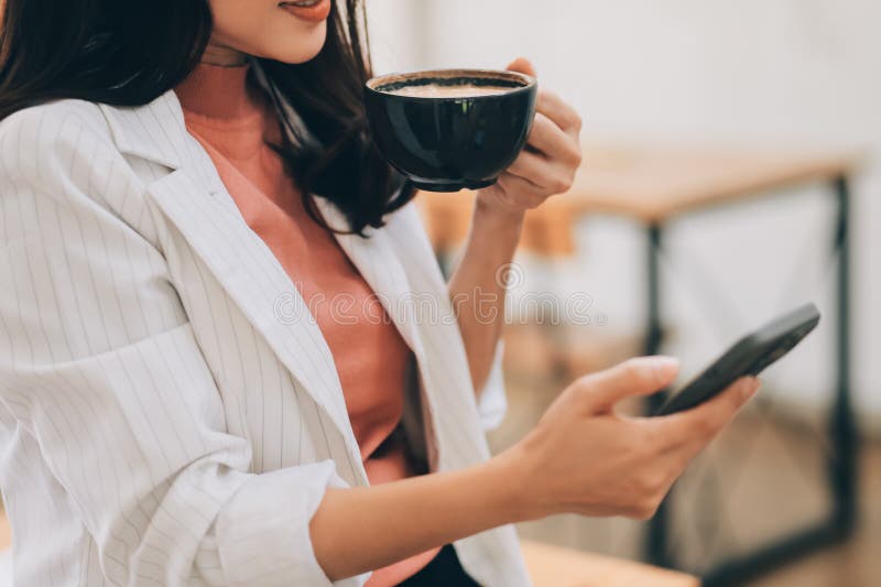 Portrait of a Happy Asian Businesswoman Using Mobile Phone Indoor ... Portrait of a Happy Asian Businesswoman Using Mobile Phone Indoor ...