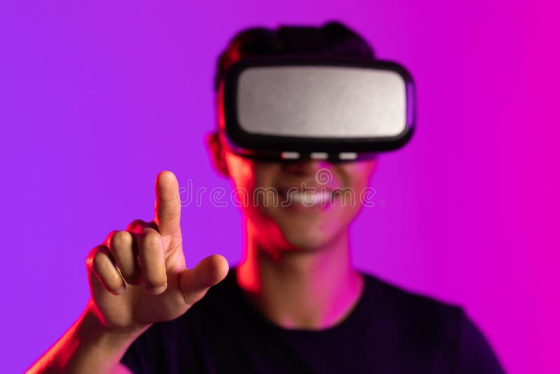 Portrait of Happy Asian Man Using Vr Headset Pointing Finger in Studio ...