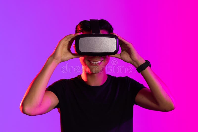 Portrait of Happy Asian Man Using Vr Headset in Studio with Purple ...
