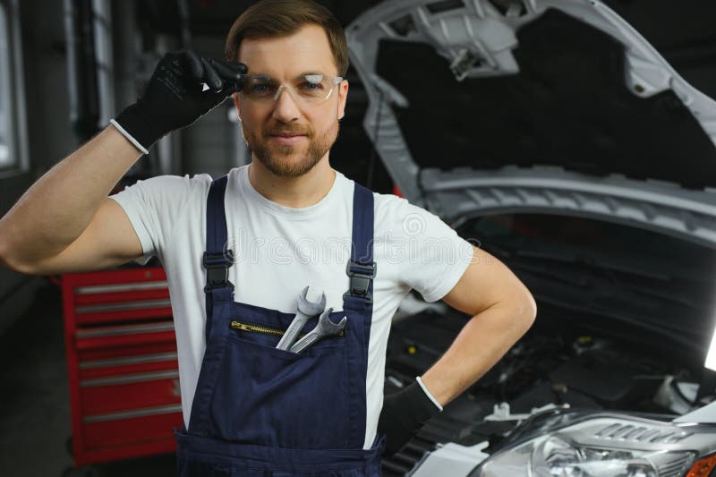 Portrait of a Happy Auto Mechanic Cleaning Hands with Cloth Stock Photo ...