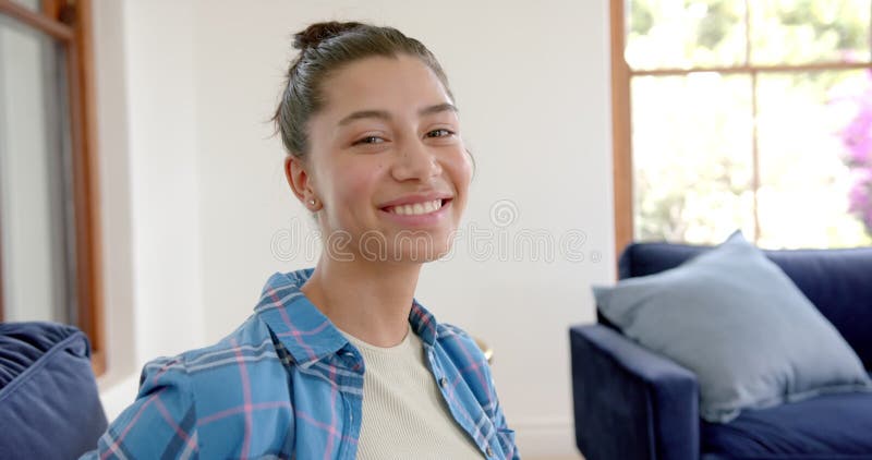Portrait of Happy Biracial Teenage Girl Standing in Sunny Room at Home ... Portrait of Happy Biracial Teenage Girl Standing in Sunny Room at Home ...