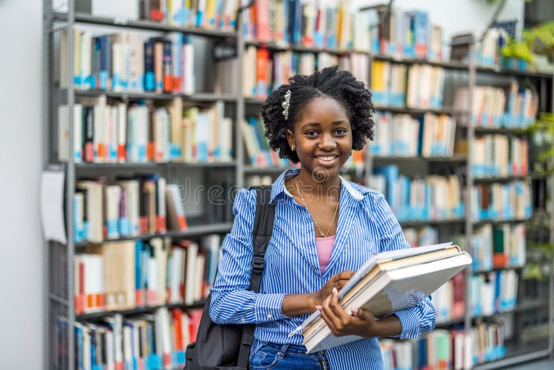 Portrait of Black Female Student Standing in a Library Stock Photo ...