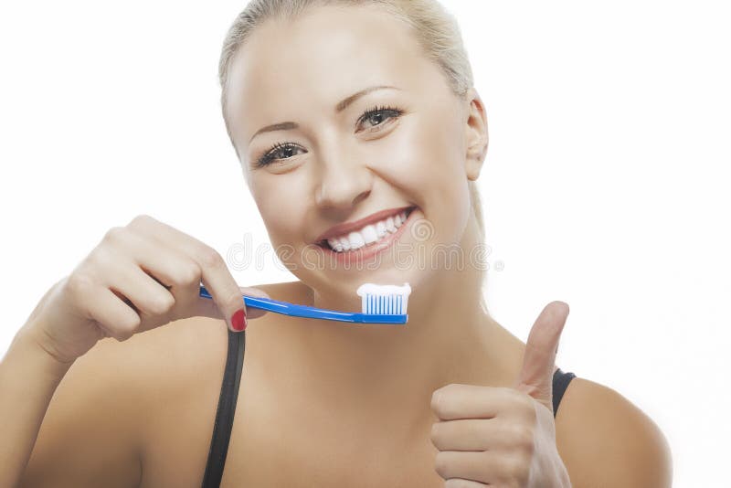 Portrait Of Happy Blond Caucasian Woman Cleaning Her Teeth With Stock