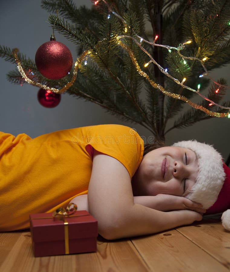 Portrait of Happy Boy Sleep Under Christmas Tree Stock Photo - Image of ...