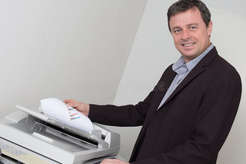 Portrait of a Happy Business Man Using Machine Stock Photo - Image of ...