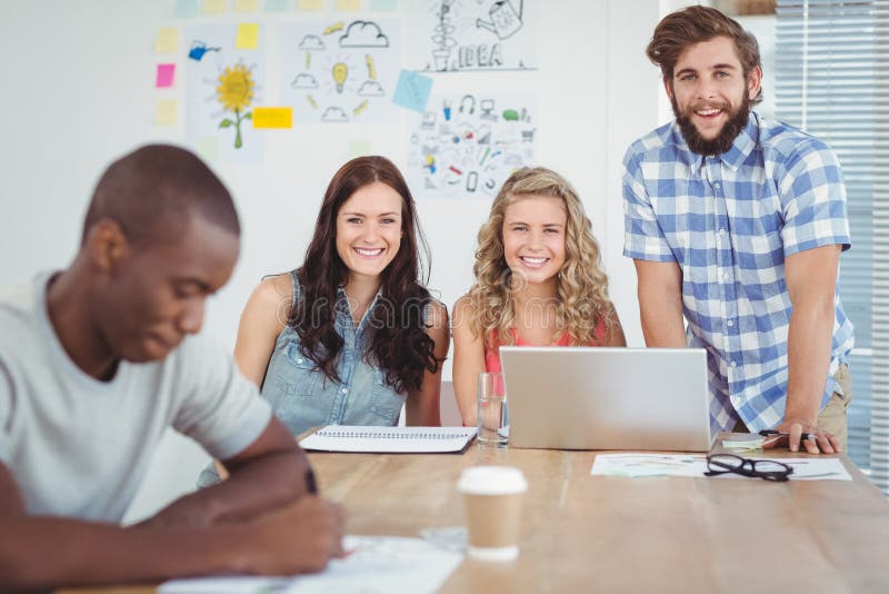 Portrait of Happy Business Professionals Working at Desk Stock Image ...