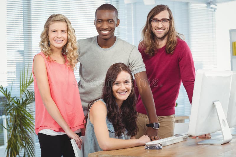 Portrait of Happy Business Team Working at Computer Desk Stock Photo ...
