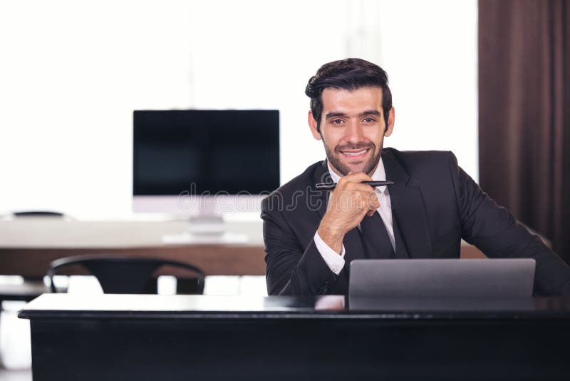 Portrait of Happy Businessman Sitting at Office Desk Stock Image ...