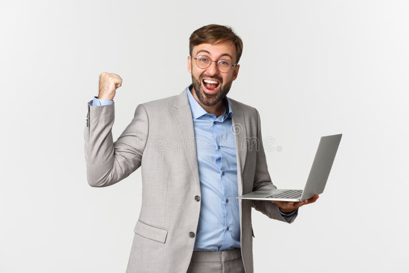Portrait Of Happy Businessman In Suit And Glasses Holding Laptop And