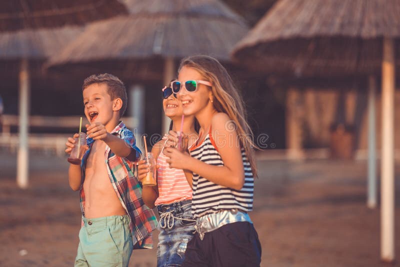 Portrait of Happy Children while Having Fun Walking on the Beach Stock ...