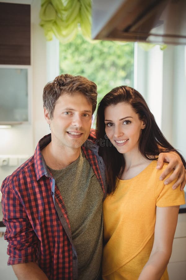 Portrait of Happy Couple Embracing in Kitchen Stock Photo - Image of ...
