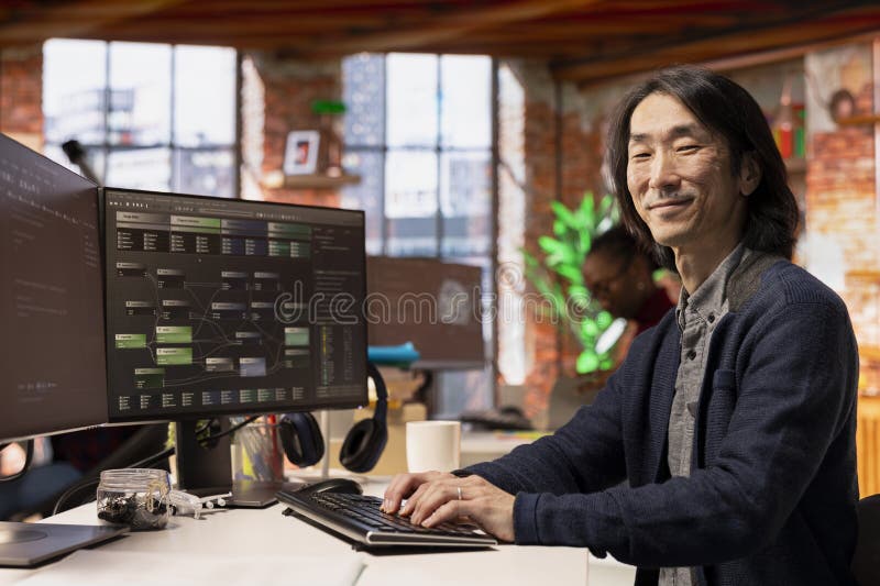 Portrait of Happy CTO Manager Using PC in Startup Office To Implement ...