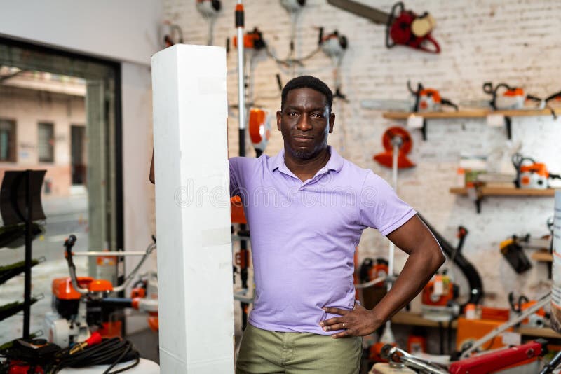 Portrait of Happy Customer with Box at Garden Tools Store Stock Photo ...