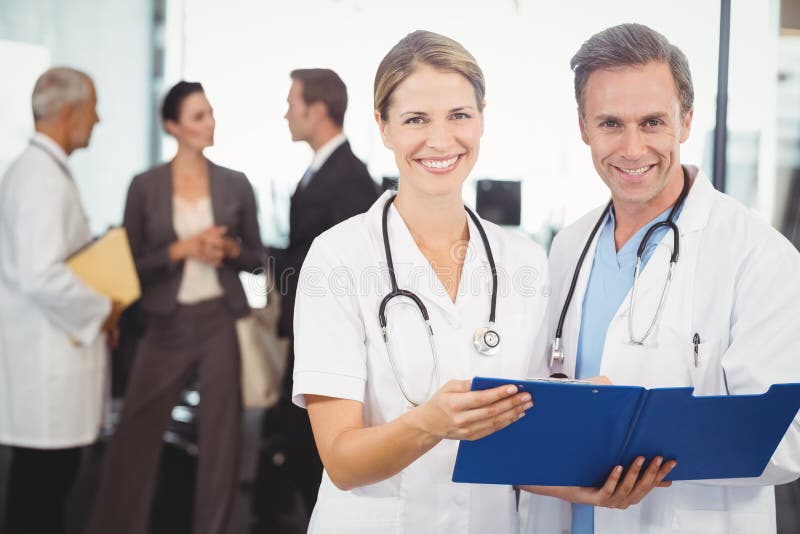 Portrait of Happy Doctors with Clipboard Stock Image - Image of care ...