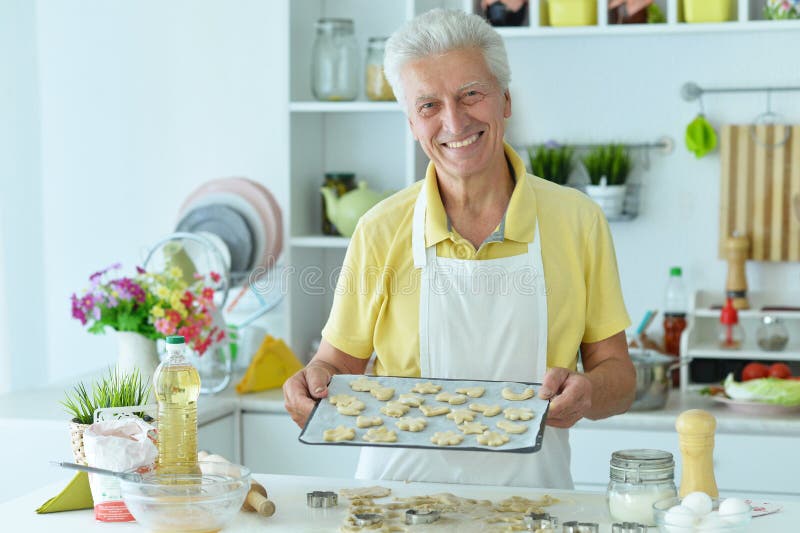 Portrait of a Happy Elderly Man Baking Cookies Stock Image - Image of ...