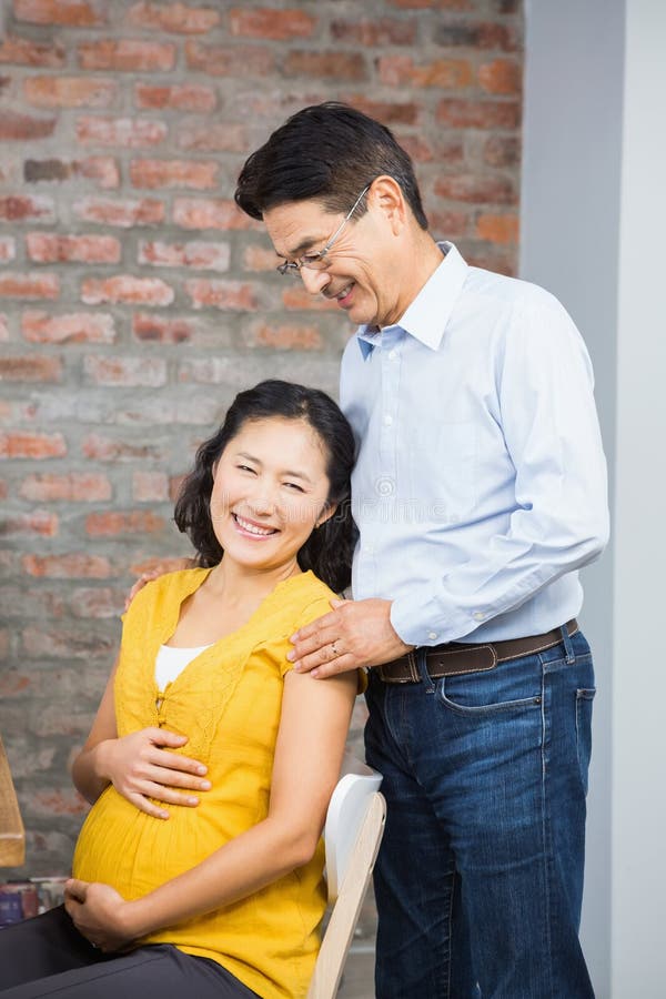 Portrait of Happy Expectant Couple Stock Photo - Image of abode, belly ...
