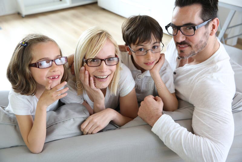 Family of Four Wearing Eyeglasses Stock Photo - Image of kids, indoors ...