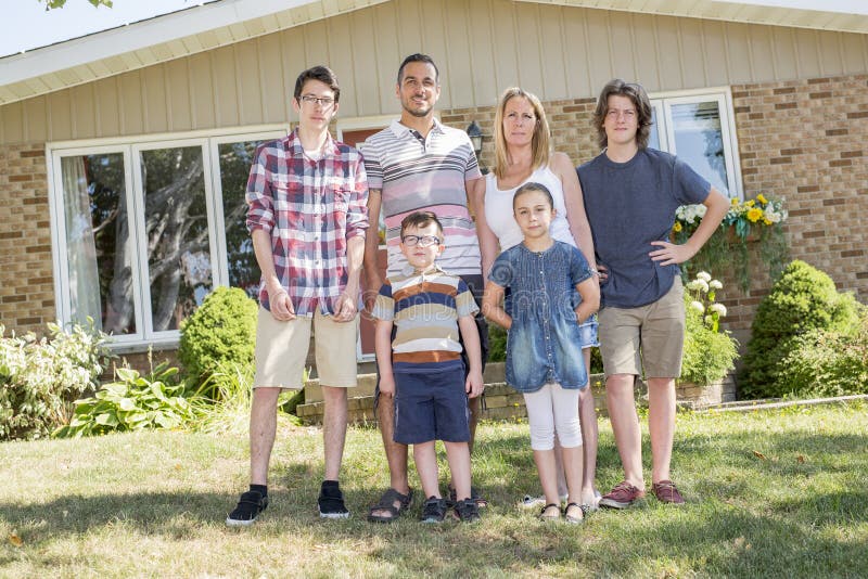 Portrait of Happy Family in Front House Stock Image - Image of girl ...