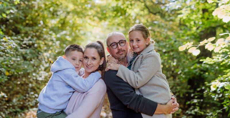 Portrait of Happy Family with Kids in a Forest. Stock Photo - Image of ...
