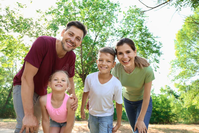 Portrait of Happy Family in Park Stock Photo - Image of love, daughter ...