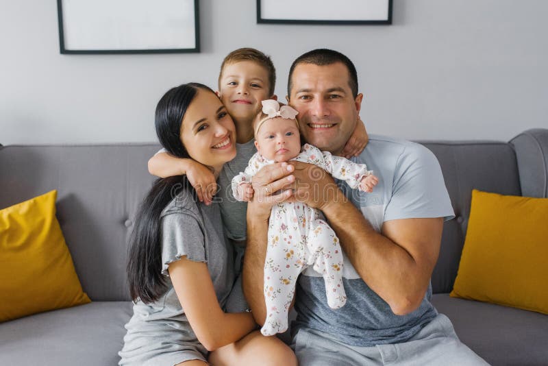 Portrait of a Happy Family Sitting on the Couch Stock Image - Image of ...