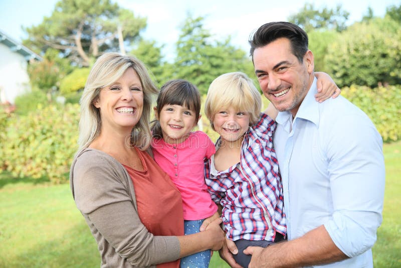 Portrait of Happy Family Spending Good Time Outdoors Stock Photo ...