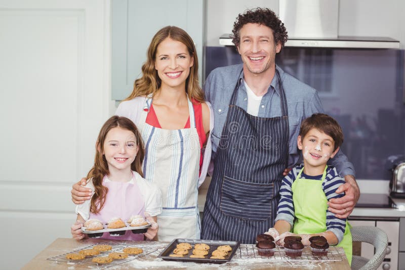 Portrait of Happy Family Standing in Kitchen Stock Photo - Image of ...