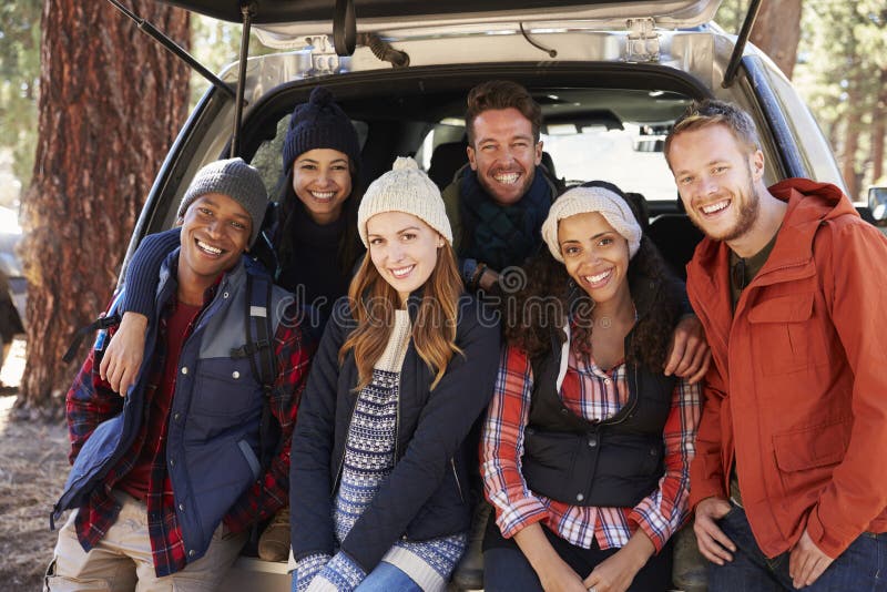 Portrait of Happy Friends Sitting in the Open Back of a Car Stock Photo ...